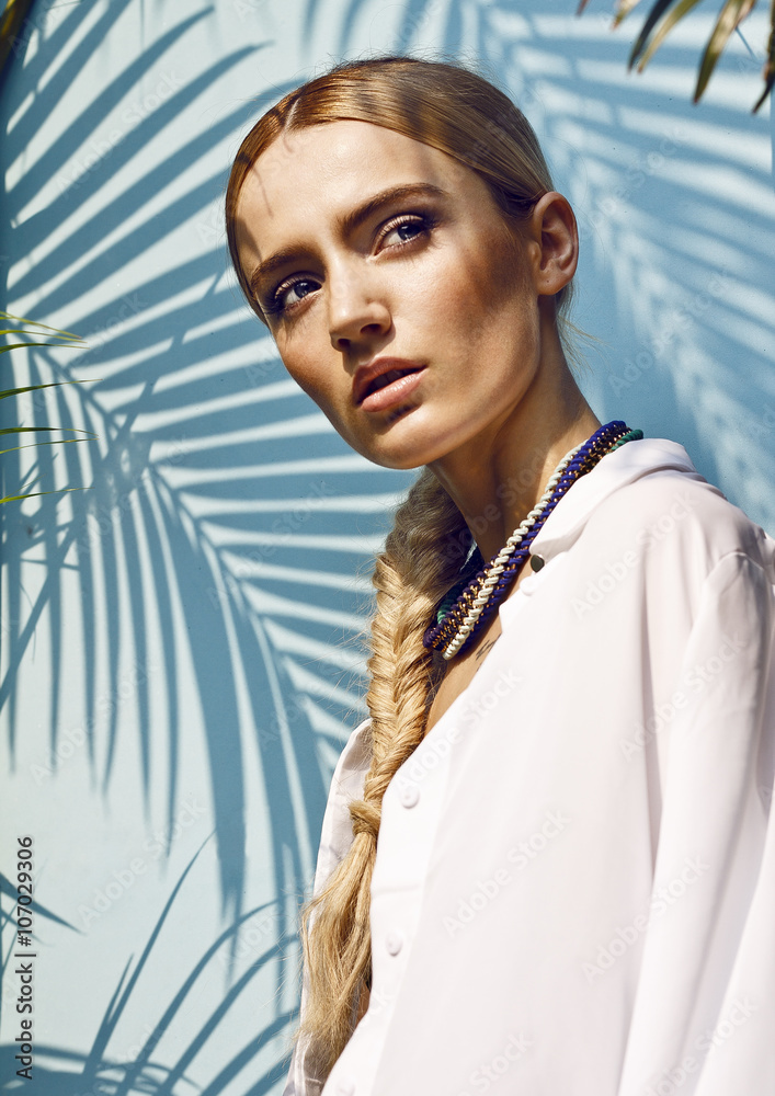 Beautiful fashion model standing in the jungle scene, thinking while ...