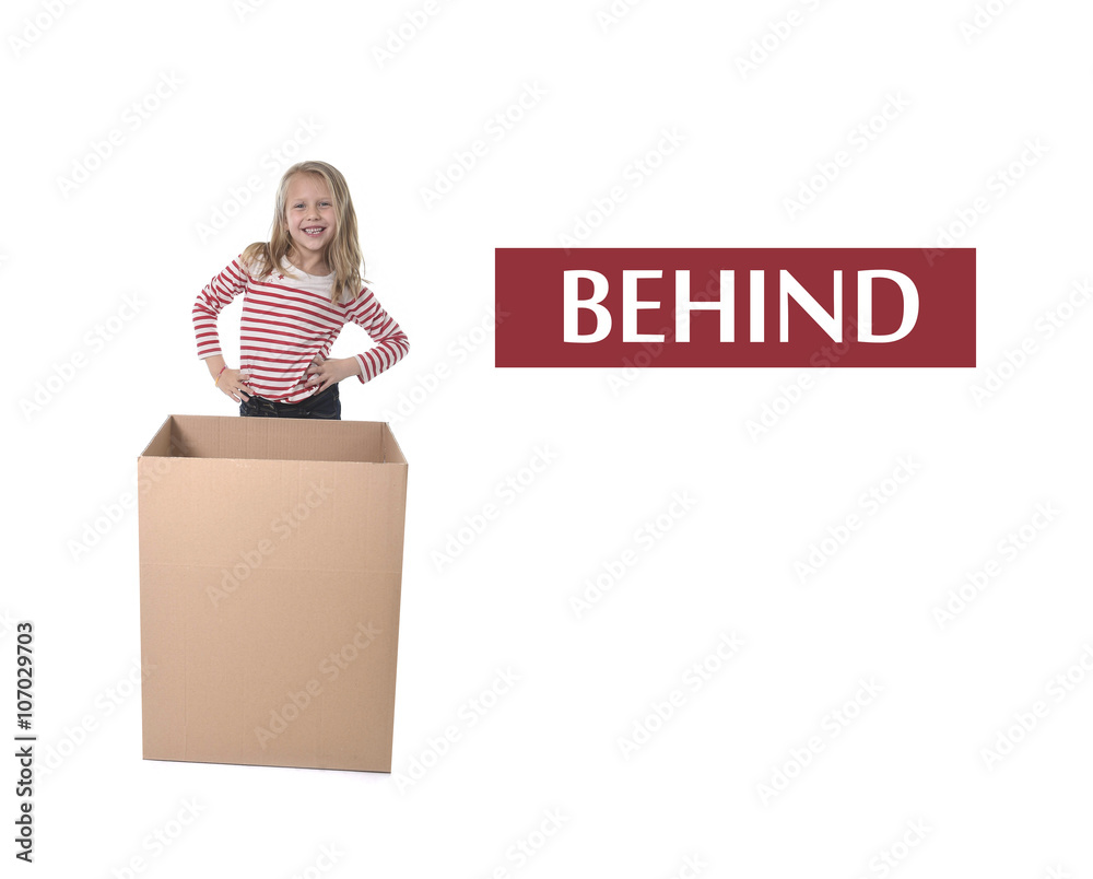 cute and sweet blond hair child standing behind cardboard box learning ...