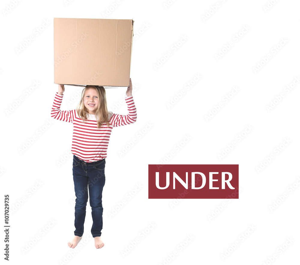 cute and sweet blond hair child standing under cardboard box learning ...