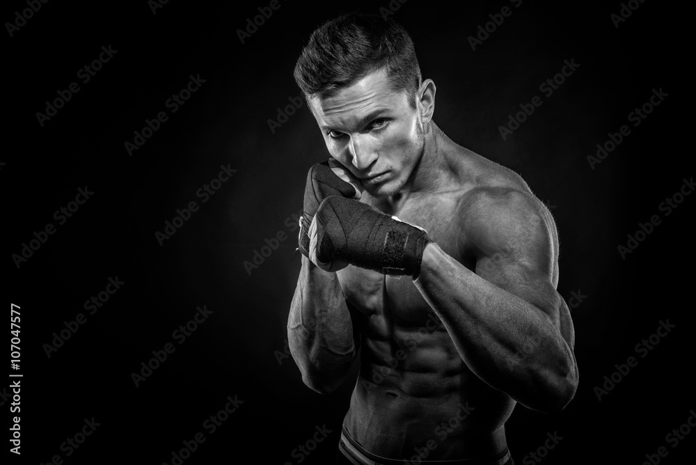 Portrait of attractive kickboxer in the dark Stock Photo | Adobe Stock