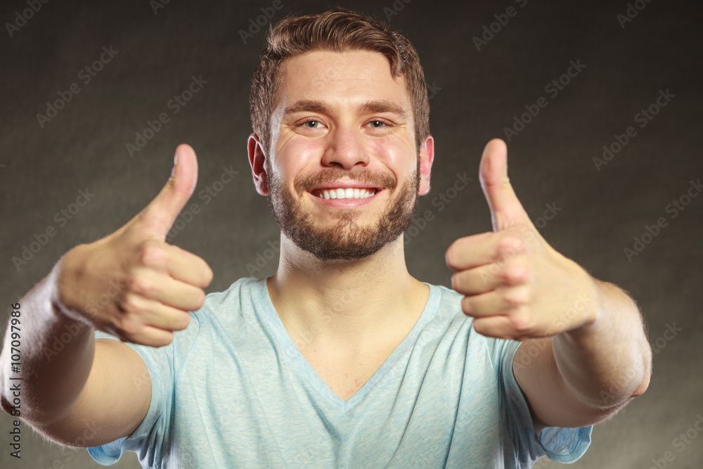 Handsome man guy giving thumb up gesture. Stock Photo | Adobe Stock