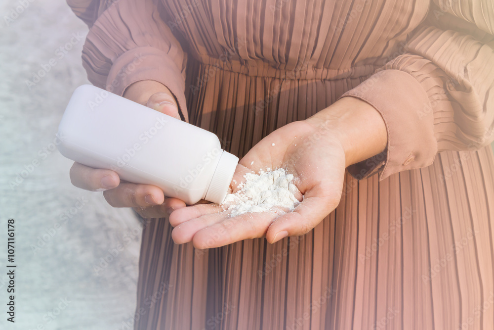 Women hand apply talcum powder Stock Photo | Adobe Stock