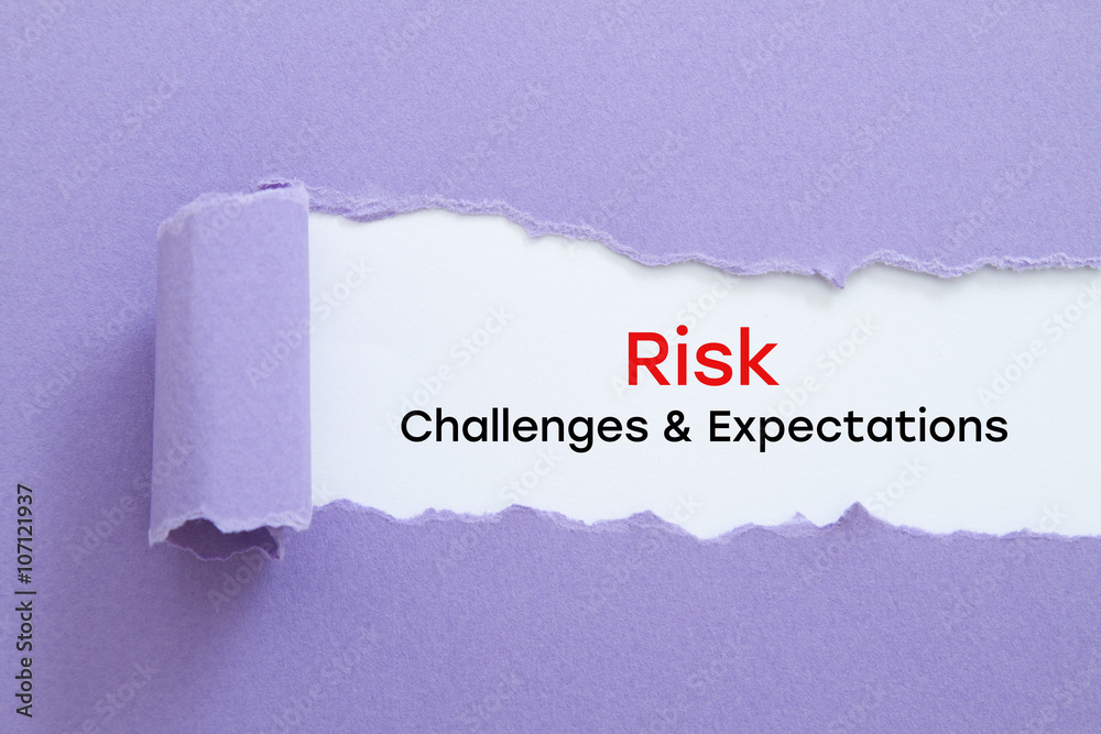 Risk - Challenges and Expectations written under torn paper. Stock ...