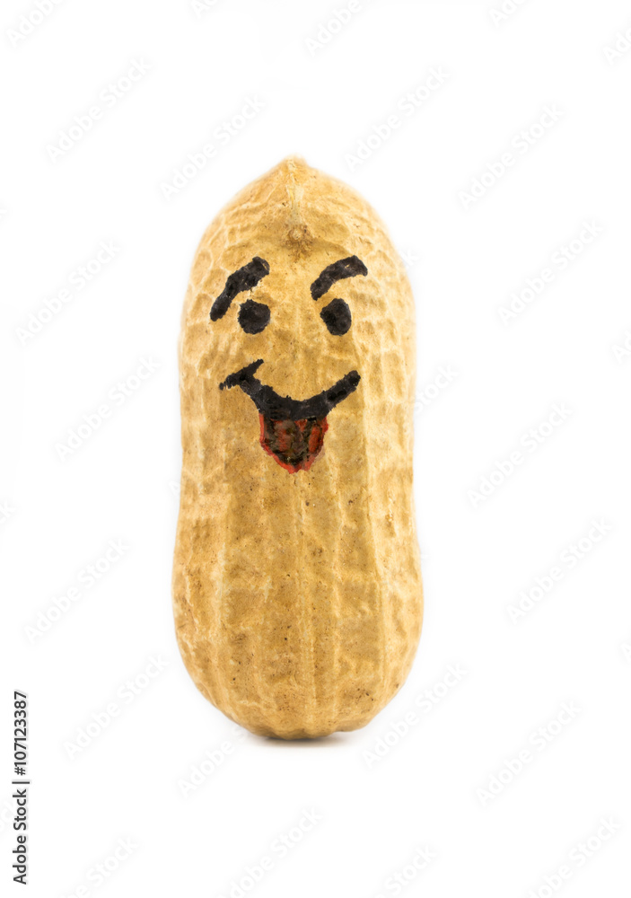 Smiley face drawn on dried peanut on white background. Concept for ...