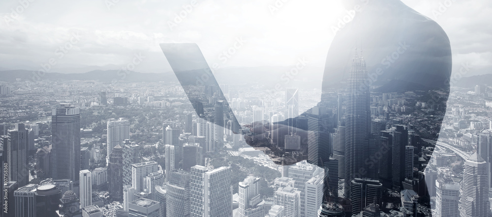 Foto de Double exposure businessman wearing black shirt, panoramic view ...