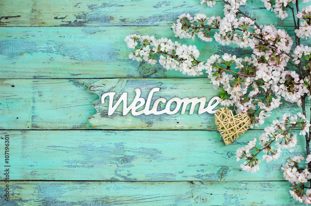 Welcome sign with spring flowers and heart Stock Photo | Adobe Stock