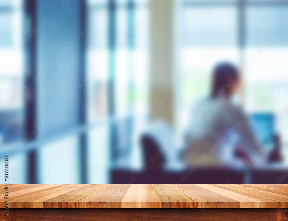 Empty light wood table top with blur office background, Leave sp Stock ...
