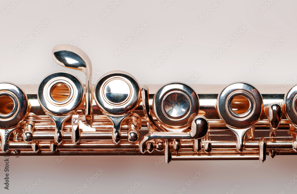 Golden flute. isolated on brown background with clipping path Stock ...