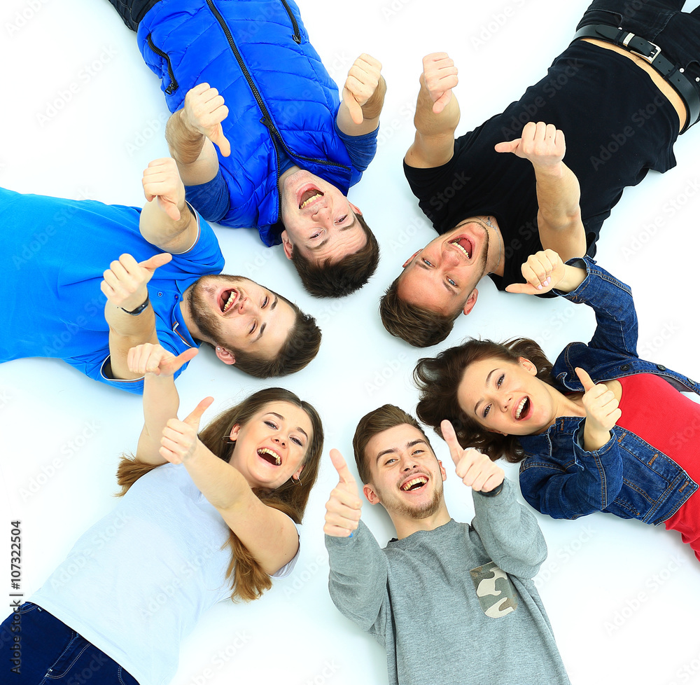Young people lying down,gesturing thumb up sign Stock Photo | Adobe Stock