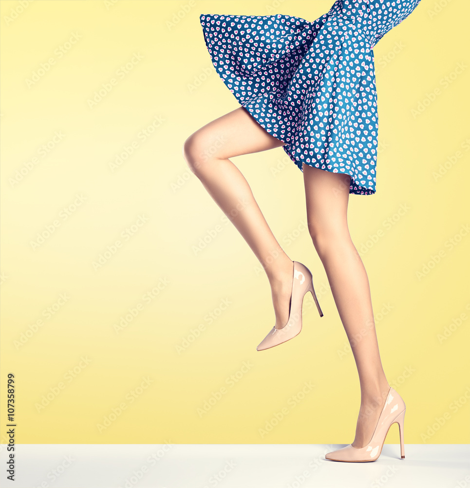 Woman legs in fashion dress and high heels, outfit Stock Photo | Adobe ...