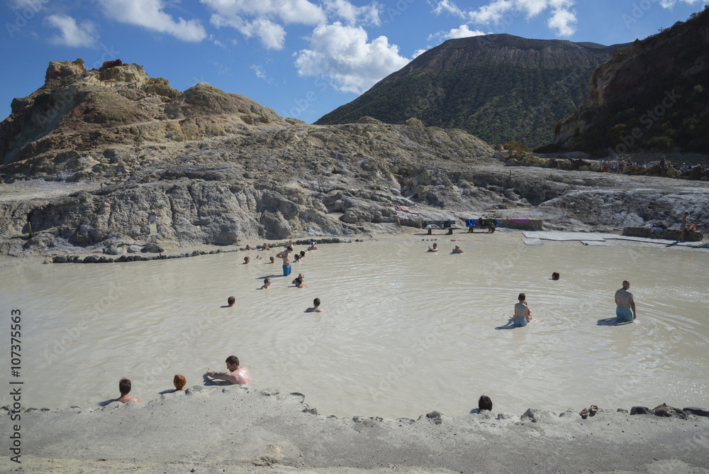 Bathers enjoying the therapeutic benefits of the volcanic mud in the ...