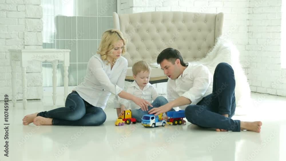 Video Stock Mom dad and son on the floor. Son playing toy car. Happy ...