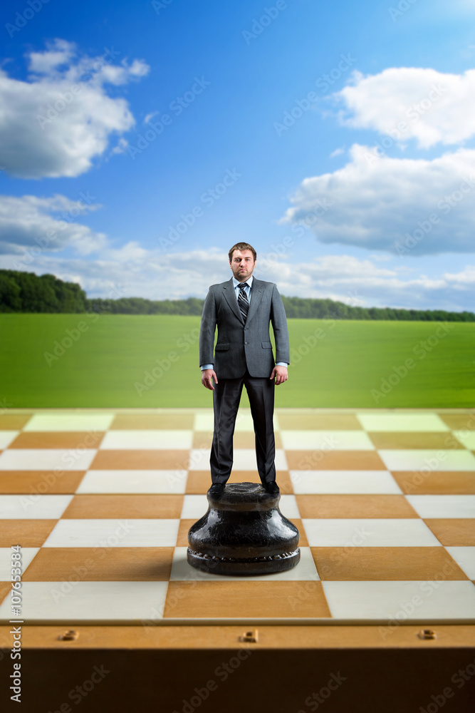 Businessman on the chess board Stock Photo | Adobe Stock
