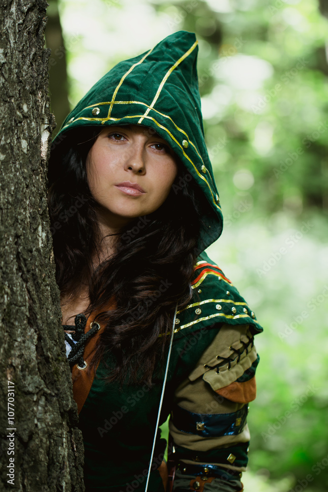 Staging photo of beautiful woman in fantasy suit with hood Stock Photo ...