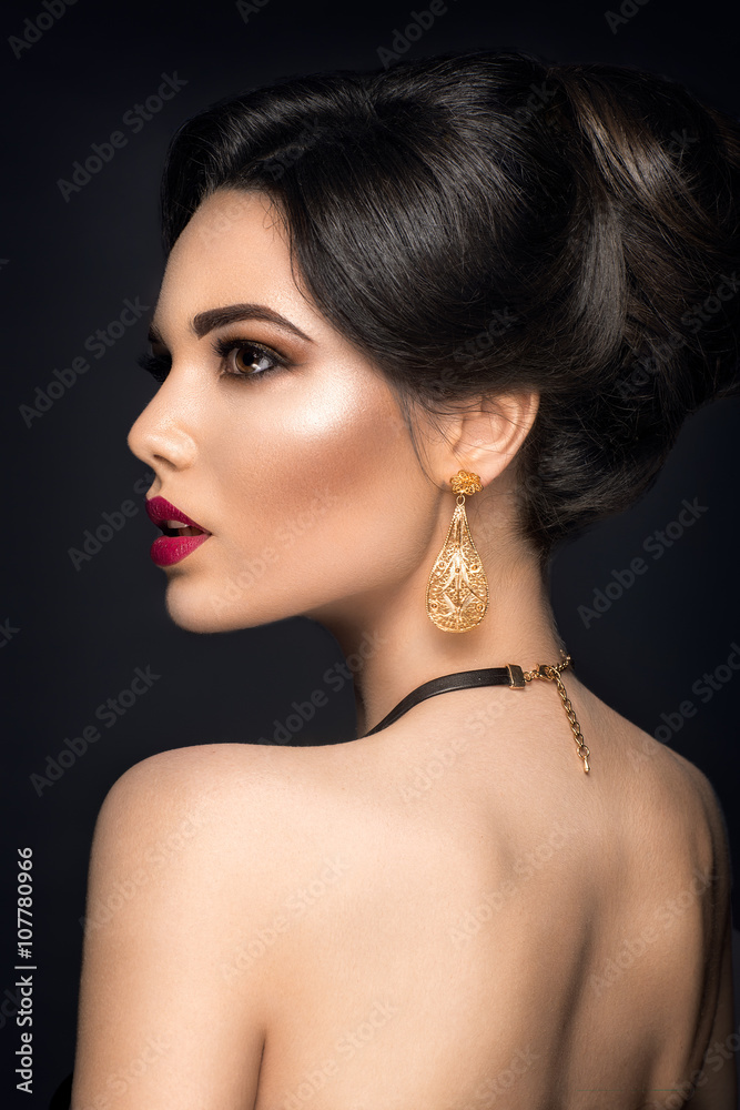Beautiful woman portrait. Young lady posing with gold jewelry. Model ...