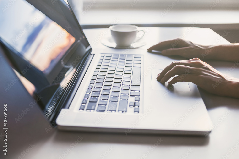 Young adult using laptop Stock Photo | Adobe Stock