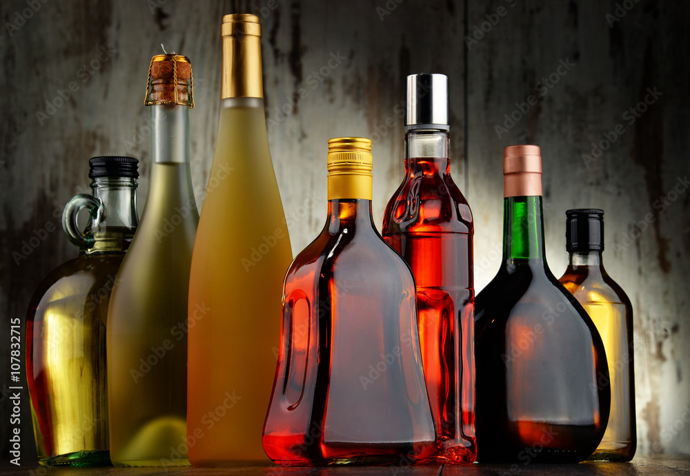 Bottles of assorted alcoholic beverages Stock Photo | Adobe Stock
