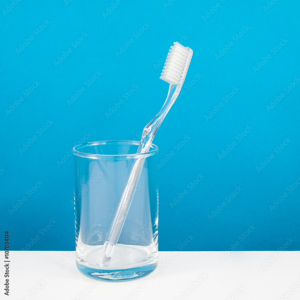 The clear toothbrush with small glass for brushing the teeth. Stock ...