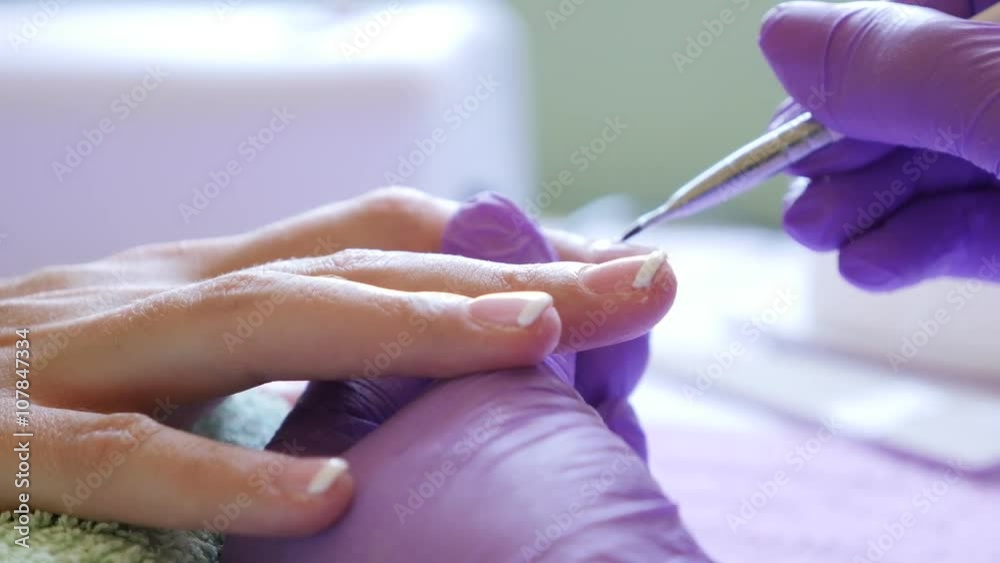 Nail white paint applying in French manicure procedure in salon 4K ...