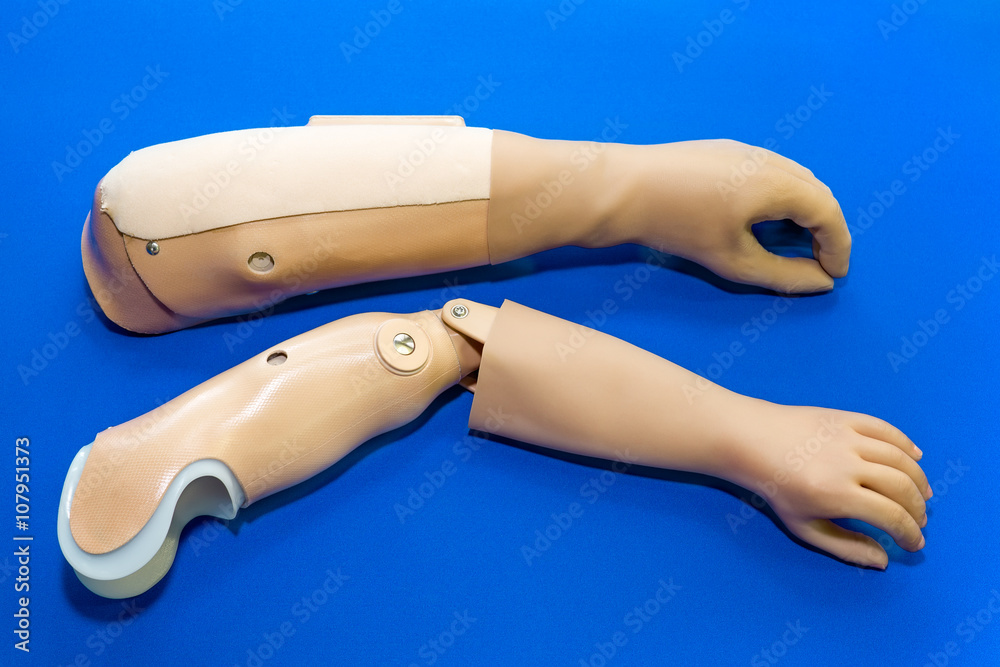 Pair of prosthetic arms over blue background. Stock Photo | Adobe Stock