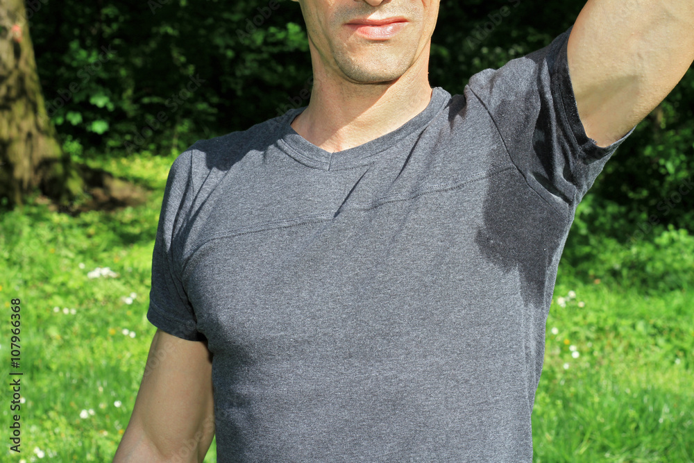 Sport man armpit sweating. Transpiration stain. Hyperthyroidism concept ...