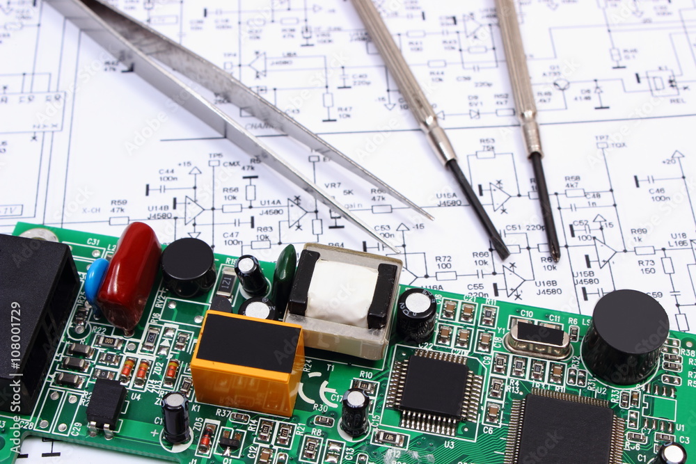 Printed circuit board and precision tools on diagram of electronics ...