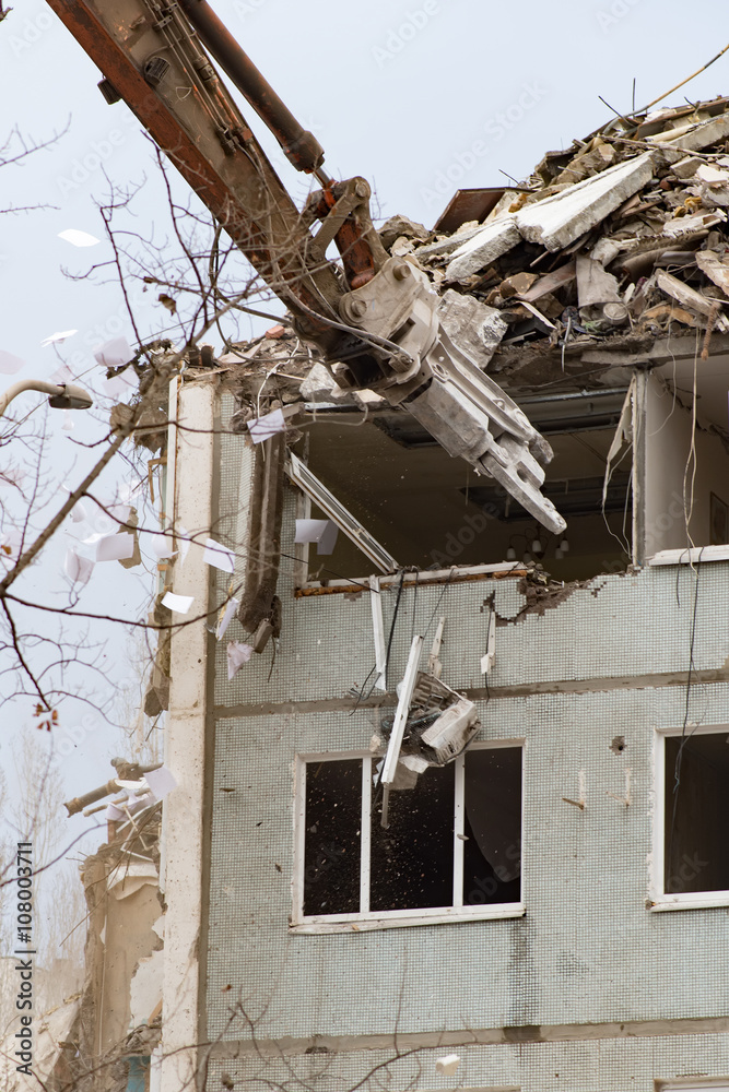 Demolition of a residential house using building hydraulic shears Stock ...