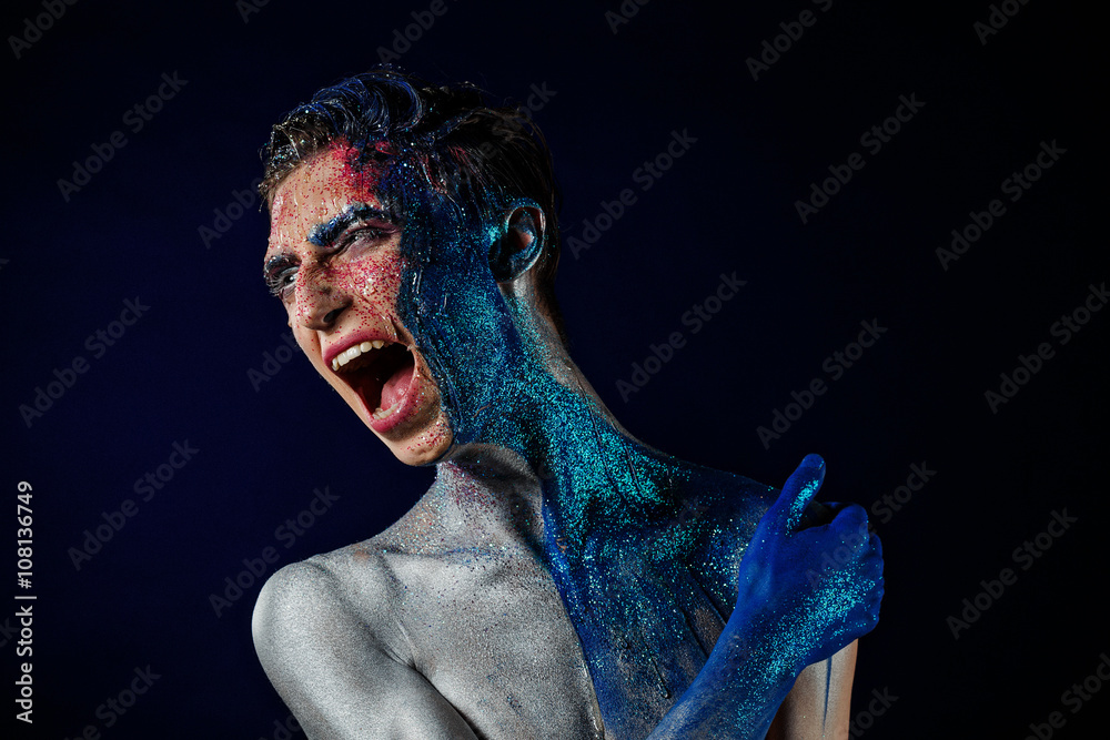 Crazy Screaming androgyne man with face art. Aggressive. Freak person ...