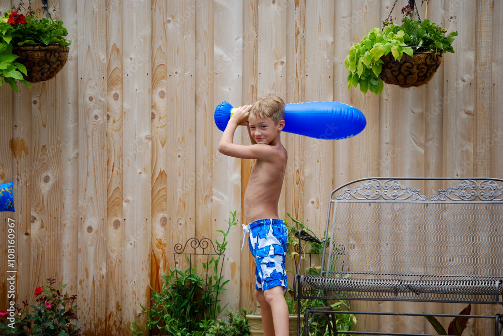 Cute kid playing baseball near pool Stock Photo | Adobe Stock