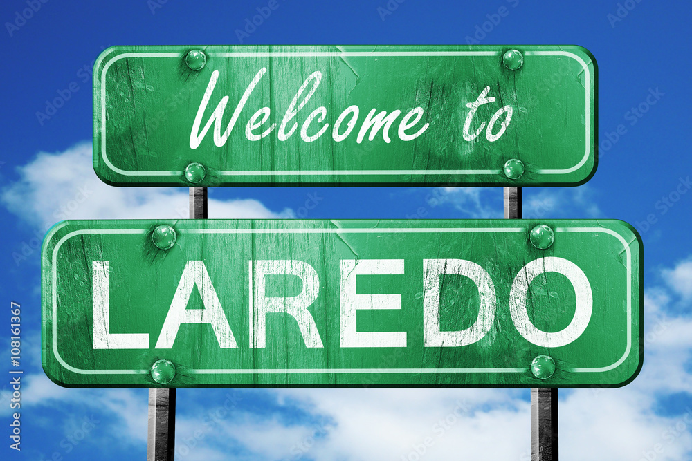 laredo vintage green road sign with blue sky background Stock ...