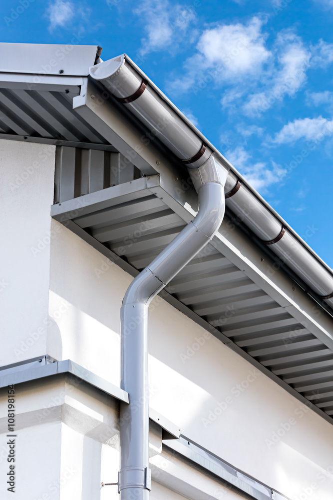 new gray metal rain gutter on house rooftop Stock Photo | Adobe Stock