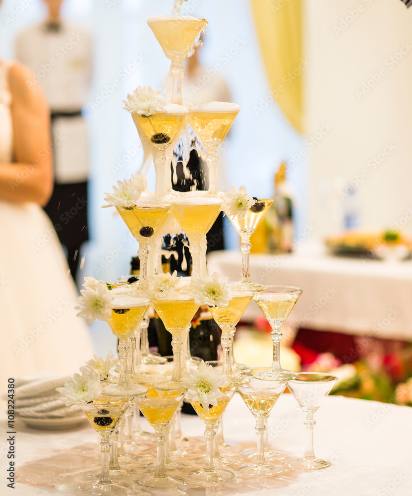 Pyramid of champagne glasses. Stock Photo | Adobe Stock