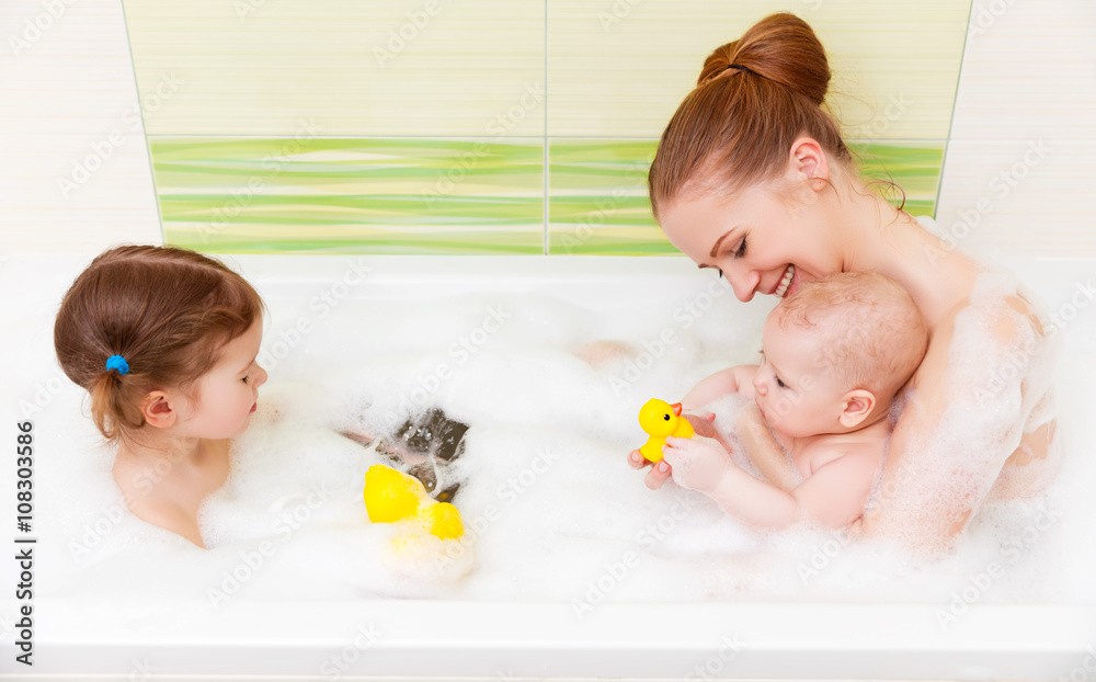 bathing in bath with foam mother together children baby Stock Photo ...