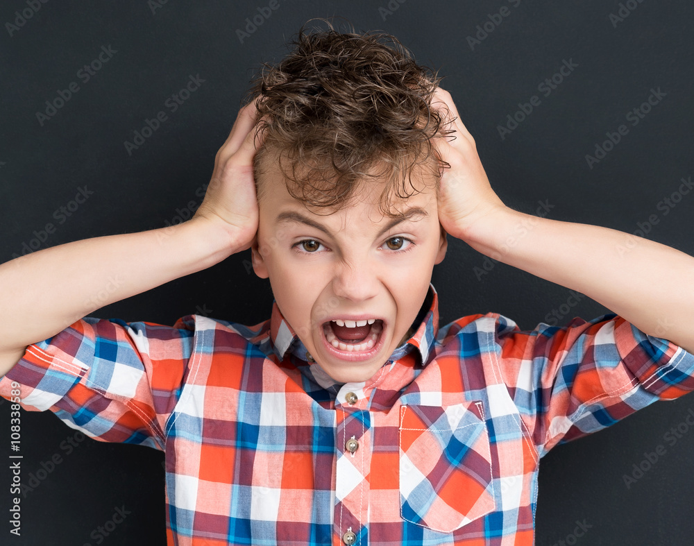 Back to school concept - shocked young boy at the black chalkboa Stock ...