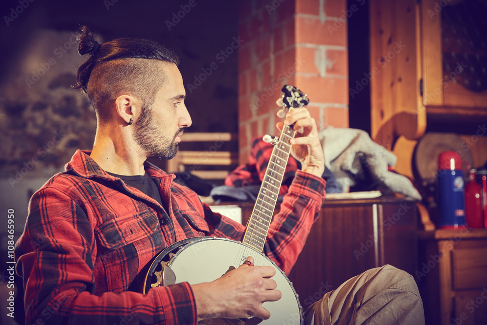 ragazzo suona banjo foto de Stock | Adobe Stock