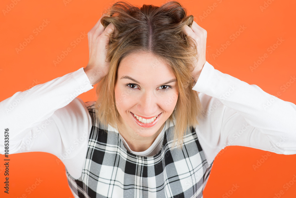junge frau rauft sich die haare Stock Photo | Adobe Stock