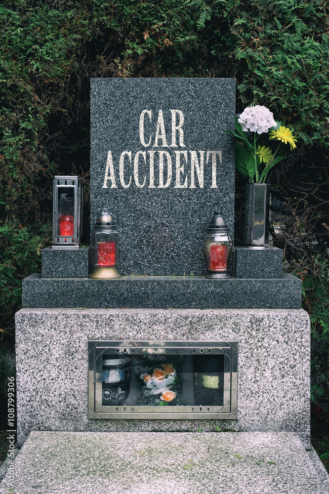 Gravestone with flowers, candles and text Motorcyclist. Metaphor of car ...
