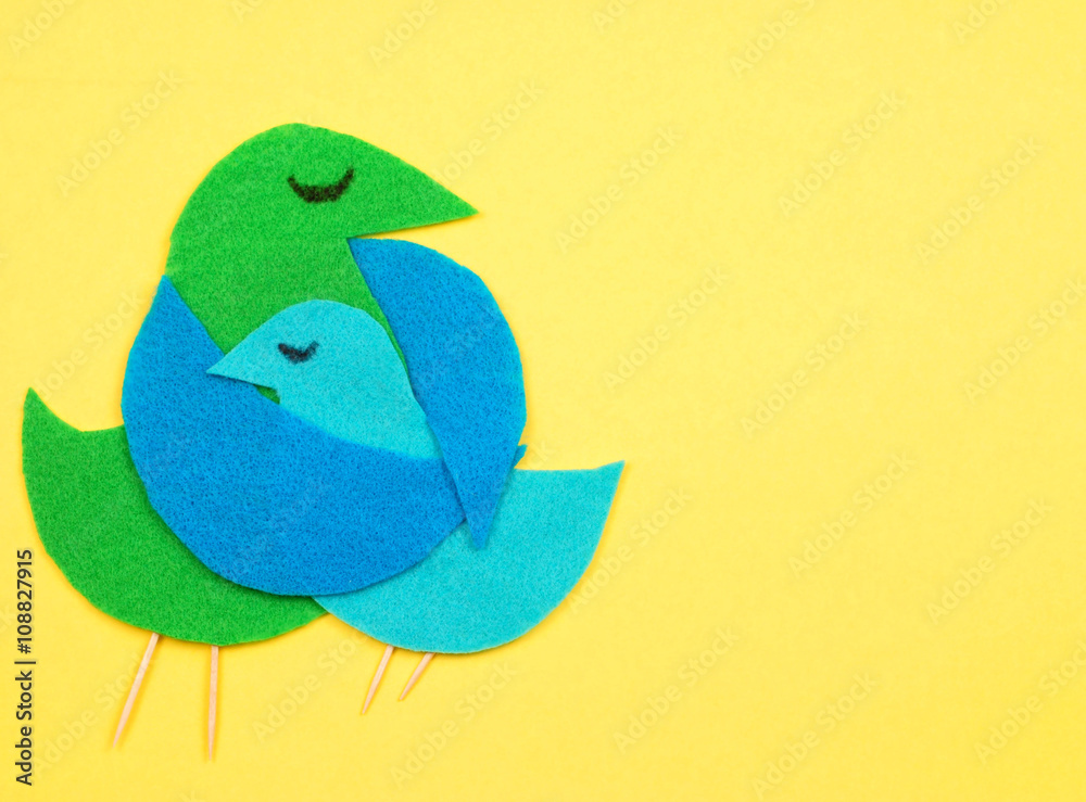 Felt cut out bird shapes in green and blue with toothpick legs and ...