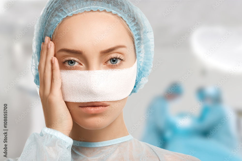 Headshot of young female face with bandage. Close up portrait of tired ...