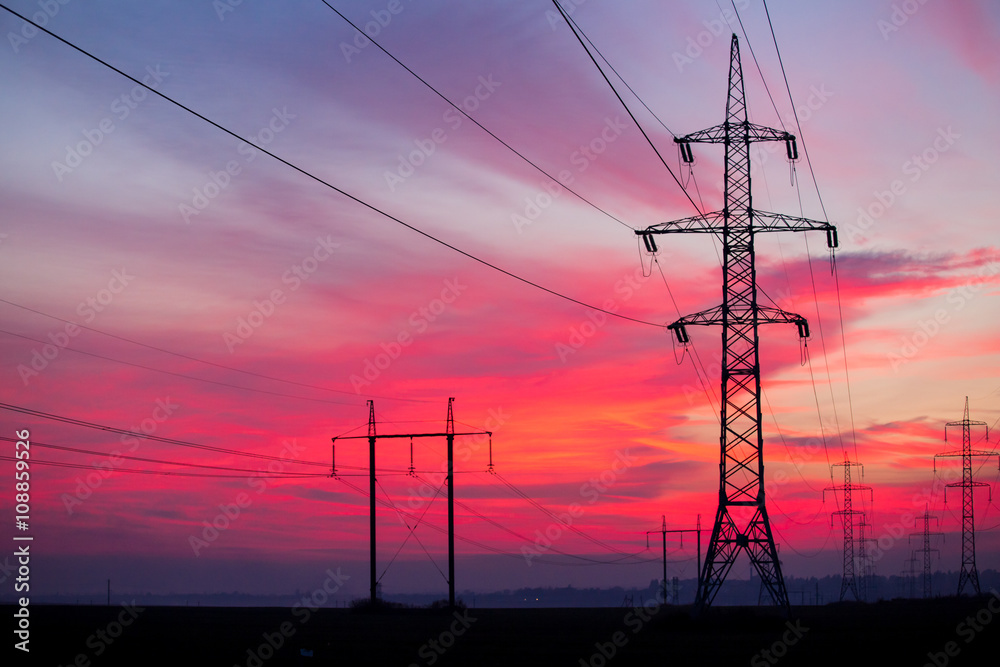 High voltage electricity pylon system on sunrise background ภาพถ่าย ...