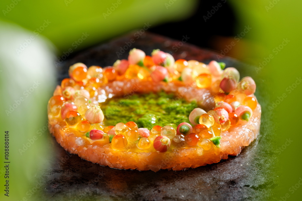 Fine dining, fresh raw ahi tuna sashimi with caviar and wild garlic ...