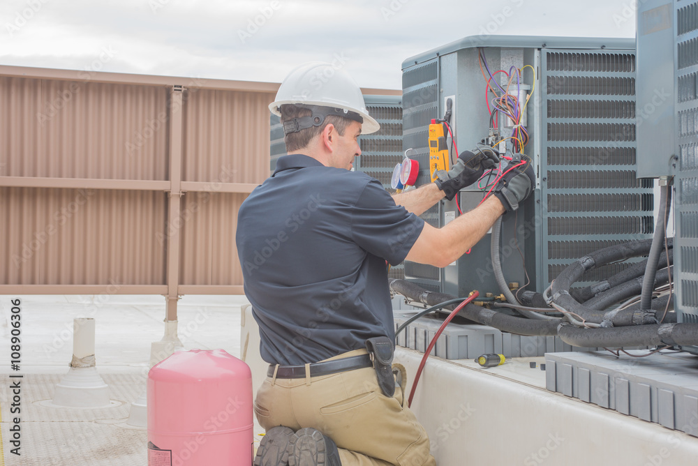 HVAC Tech Checking Condenser Stock Photo | Adobe Stock