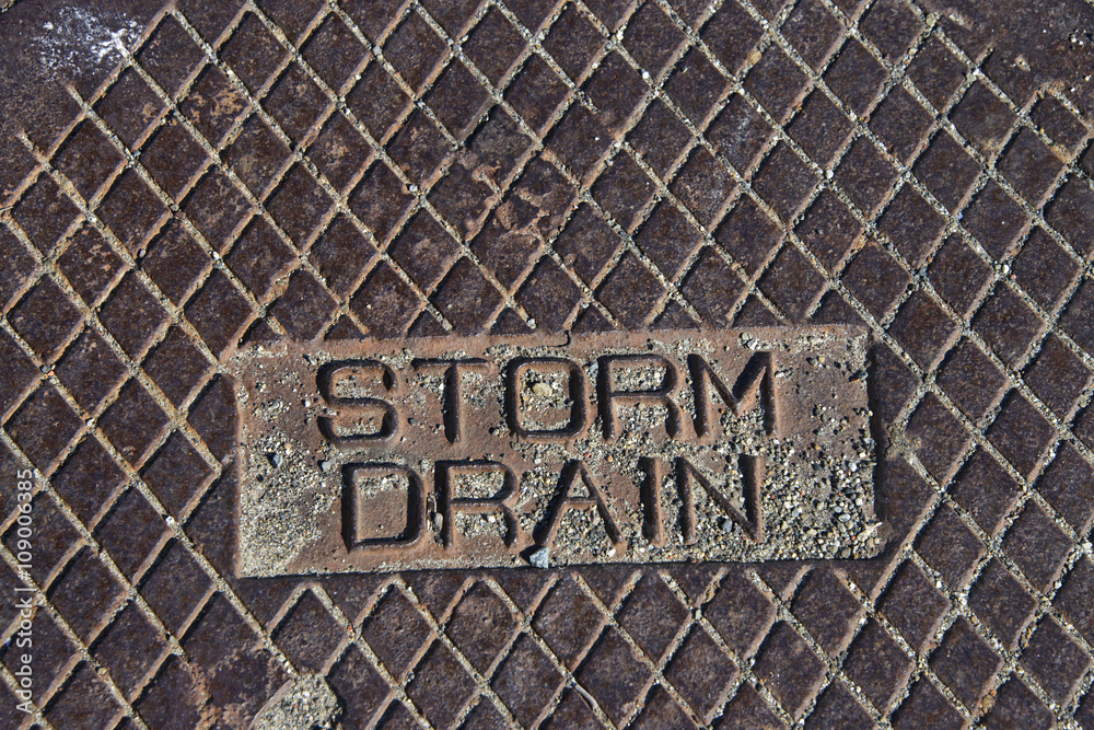 Rustic grunge storm drain manhole cover close up on storm drain Stock ...