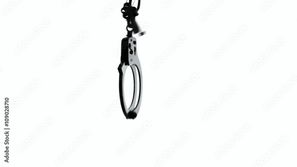 Dancing handcuffs. Close-up silhouette symbolic shot: law enforcement ...