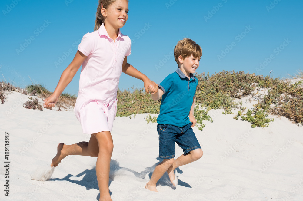 Children running on beach Stock Photo | Adobe Stock