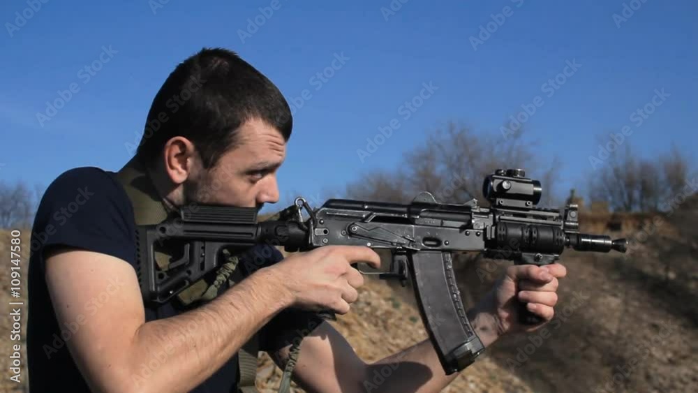 man firing customised russian machine gun, medium Stock Video | Adobe Stock