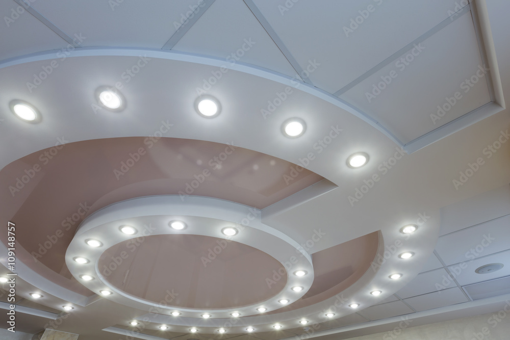 Layered ceiling with embedded lights and stretched ceiling inlay Stock ...
