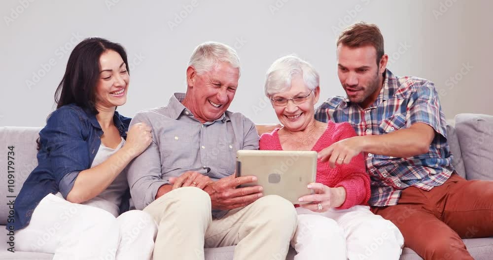 Multi generation family using tablet Stock Video | Adobe Stock