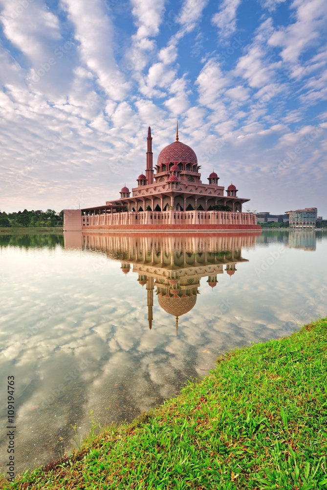 Vertical image of Morning view of Putra Mosque and mirror like ...