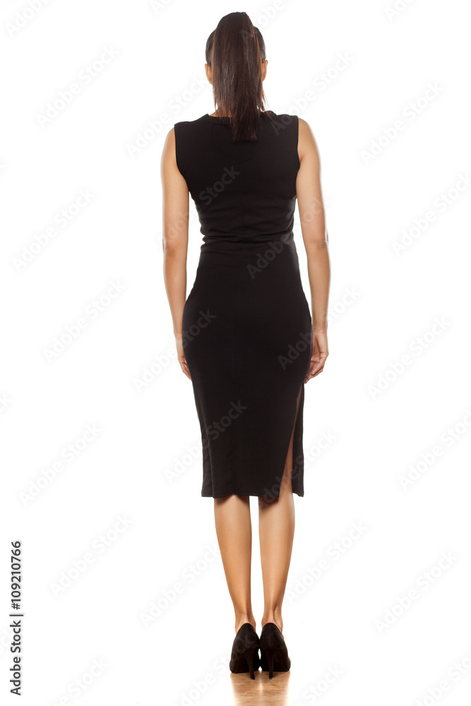 Back view of a young woman in a tight black dress Stock Photo | Adobe Stock